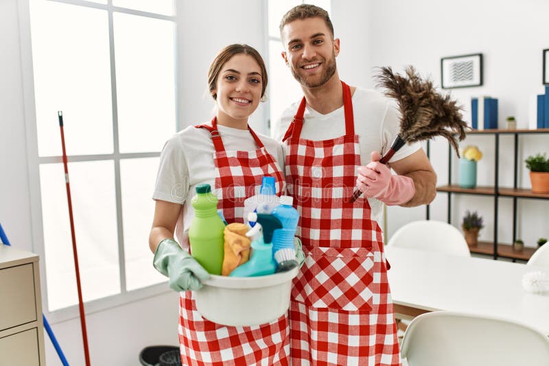 Young Caucasian Couple Cleaning at Home Stock Photo - Image of apron ...