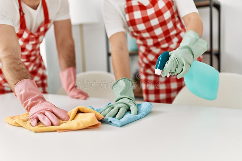 Young Caucasian Couple Cleaning Table Using Rag and Diffuser at Home ...