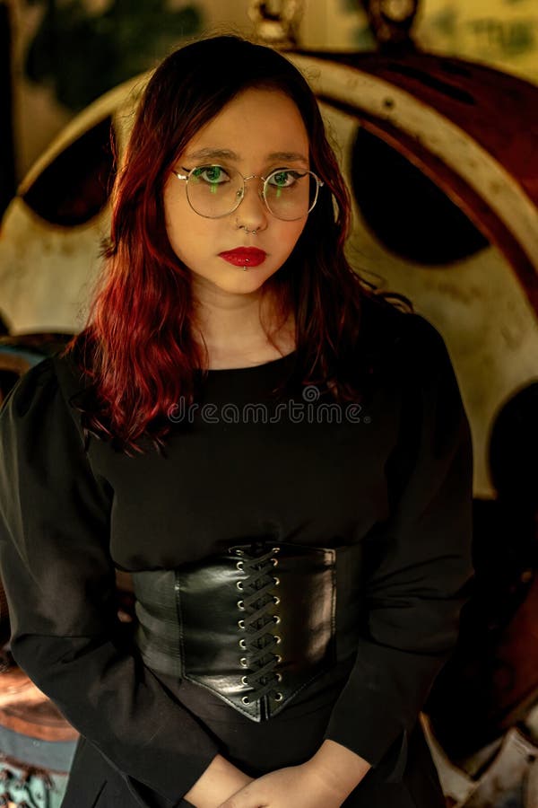 Young Caucasian Dark Haired Girl With Red Streaks In Black Dress Outfit