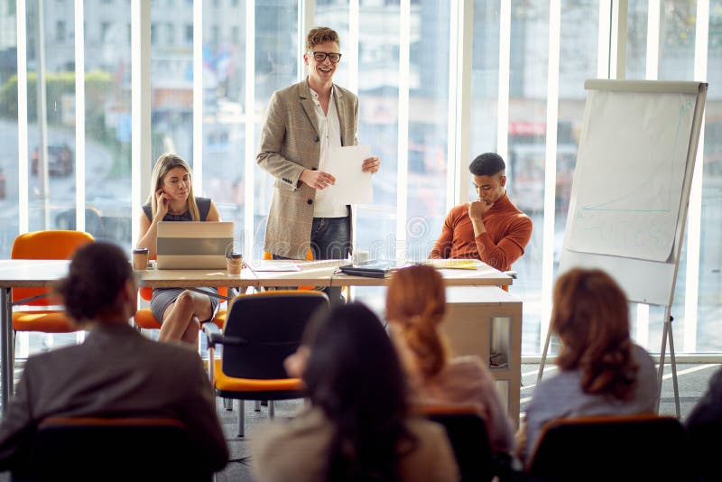 Young Caucasian Employee Holding Presentation Stock Photo - Image of ...