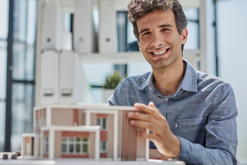Young Caucasian Engineer Man Making Building Model with the Use of ...