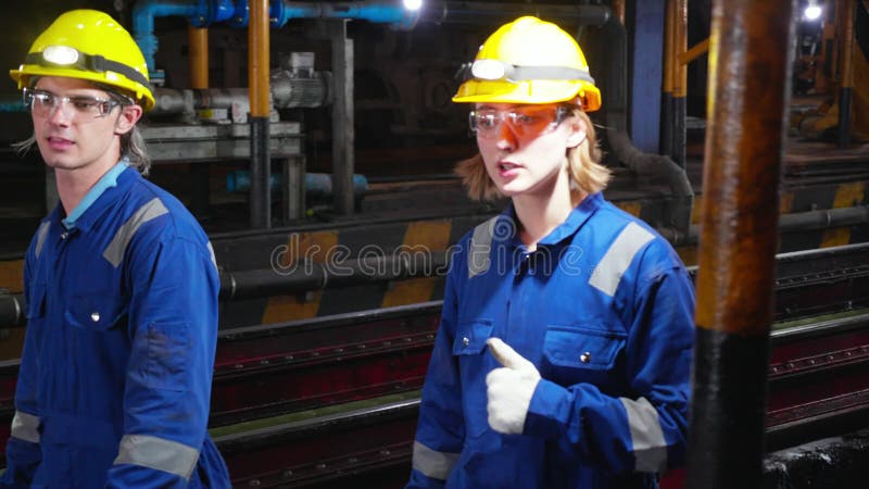 Young Caucasian Engineer Man and Woman Walking Check and Maintenance ...