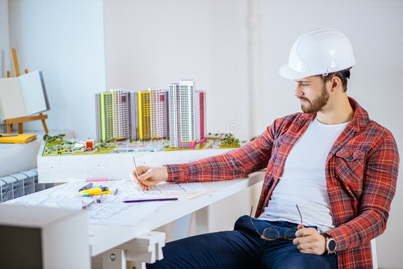 Young Caucasian Engineer in Office Stock Photo - Image of blueprint ...
