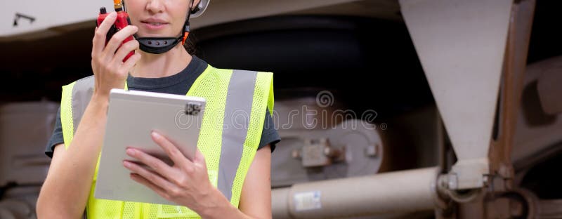 Young Caucasian Engineer Woman Using Radio for Command with Worker ...
