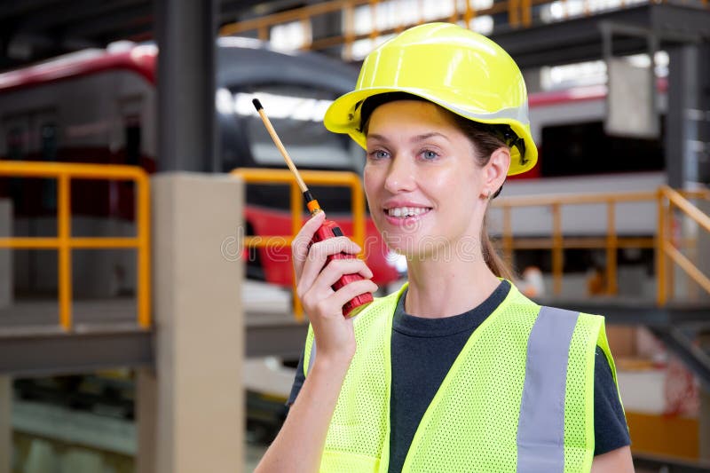Young Caucasian Engineer Woman Using Radio for Command with Worker ...