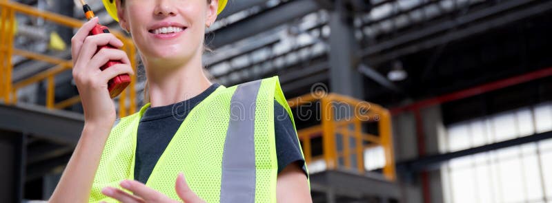 Young Caucasian Engineer Woman Using Radio for Command with Worker ...