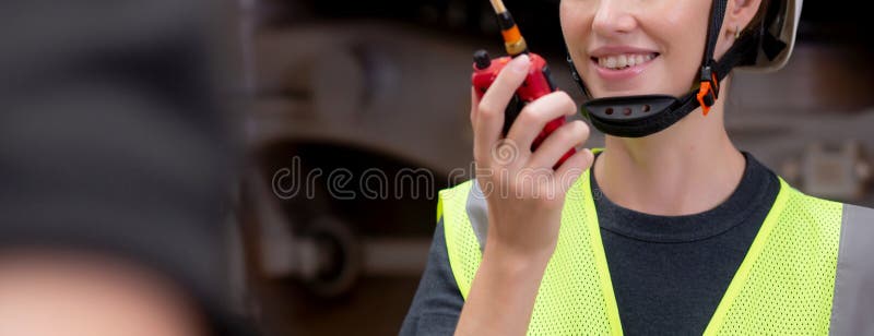 Young Caucasian Engineer Woman Using Radio for Command with Worker ...