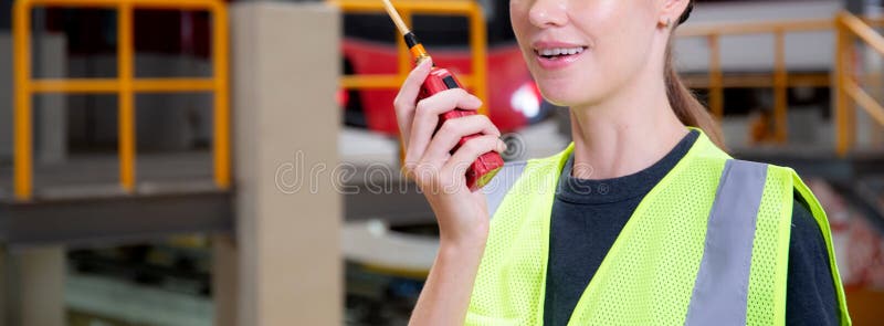 Young Caucasian Engineer Woman Using Radio for Command with Worker ...