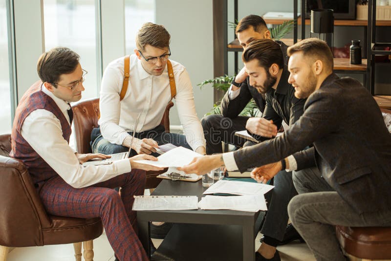 Confident Young Men in Suits Coworking in Boardroom Stock Image - Image ...