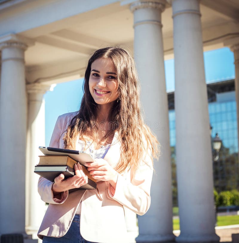 Young Caucasian Female Student with Books on Campus Stock Image - Image ...