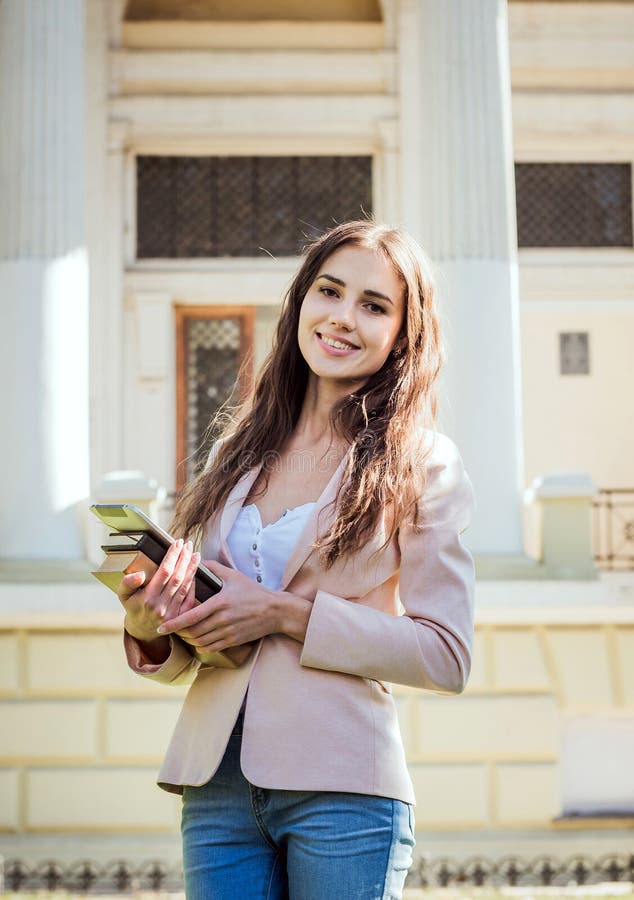 Young Caucasian Female Student with Books on Campus Stock Photo - Image ...