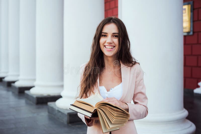Young Caucasian Female Student with Books on Campus Stock Image - Image ...