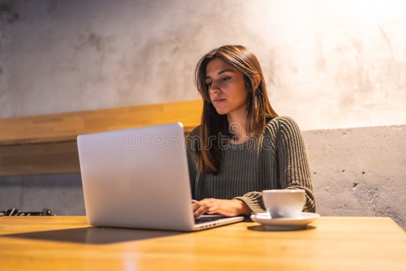 Young Caucasian Female Working on a Laptop in a Cafe Stock Image ...