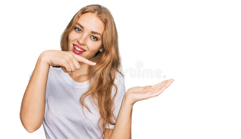 Young Caucasian Girl Wearing Casual White T Shirt Amazed And Smiling To