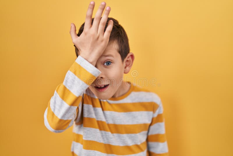Young Caucasian Kid Standing Over Yellow Background Surprised with Hand ...