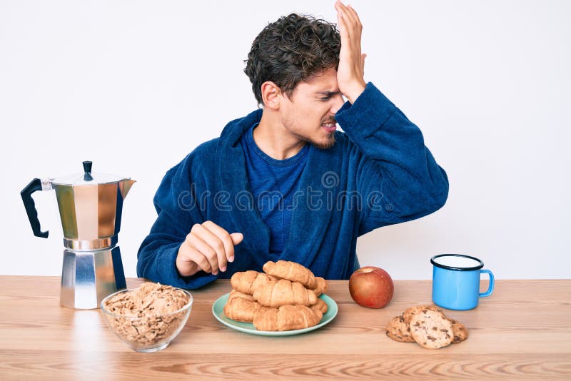 Young Caucasian Man with Curly Hair Sitting on the Table Having ...