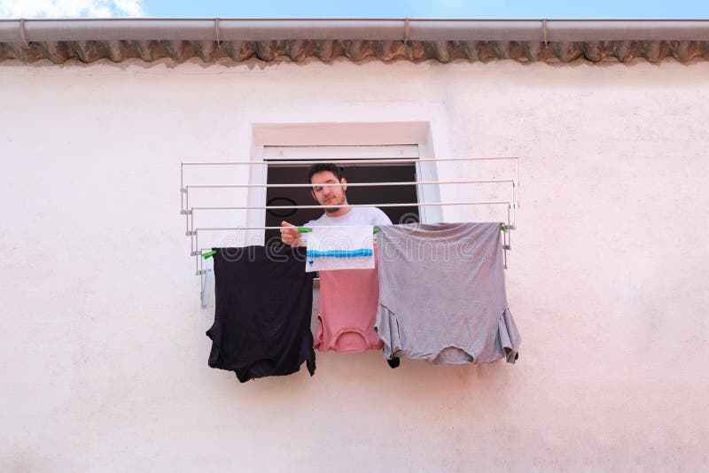 693 Man Hanging Clothes Line Stock Photos - Free & Royalty-Free Stock ...