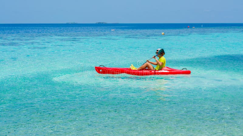 Young Caucasian Man Kayaking in Sea at Maldives. Stock Photo - Image of ...