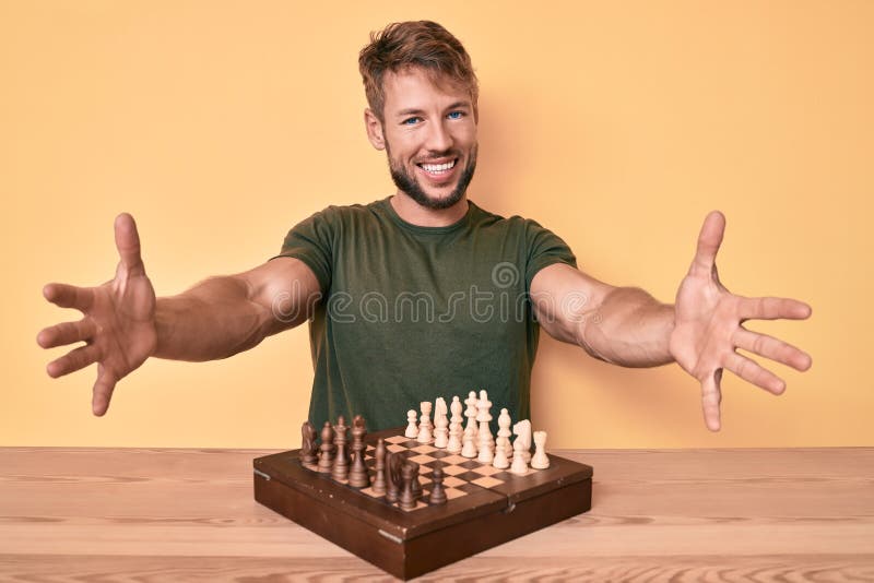 Young Caucasian Man Playing Chess Sitting on the Table Looking at the ...