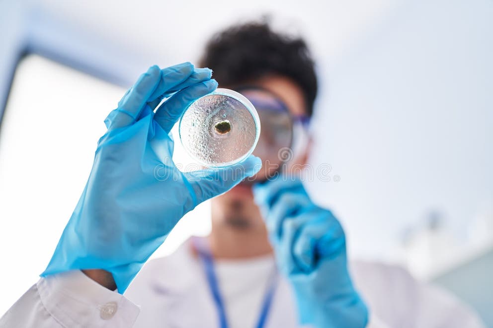 Young Caucasian Man Scientist Using Magnifying Glass at Laboratory ...