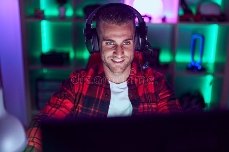 Young Caucasian Man Streamer Playing Video Game Using Computer at ...