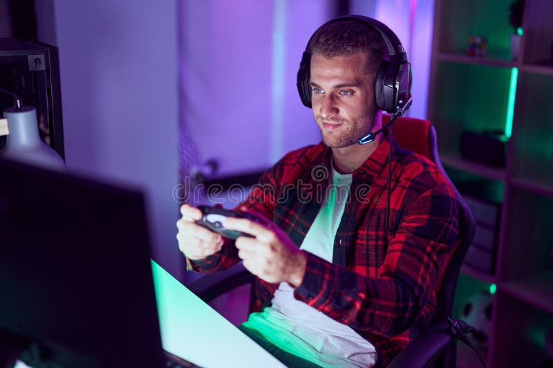 Young Caucasian Man Streamer Playing Video Game Using Joystick at ...