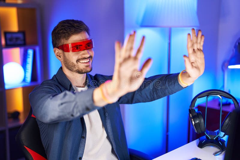 Young Caucasian Man Streamer Playing Video Game Using Virtual Reality ...