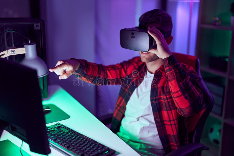 Young Caucasian Man Streamer Playing Video Game Using Virtual Reality ... Young Caucasian Man Streamer Playing Video Game Using Virtual Reality ...