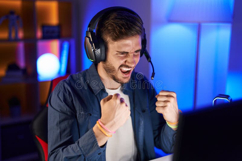 Young Caucasian Man Streamer Playing Video Game with Winner Expression ...