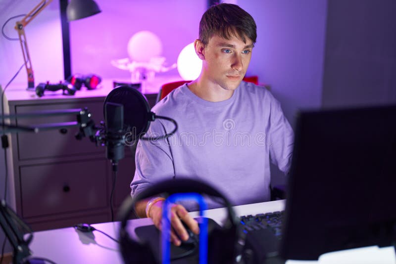 Young Caucasian Man Streamer Sitting on Table with Serious Expression ...