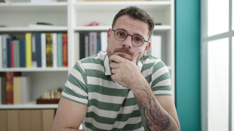 Young Caucasian Man Thinking at Library University Stock Footage ...