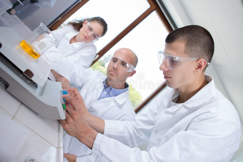 Young Caucasian Scientists Studying Molecular Structure in Laboratory ...