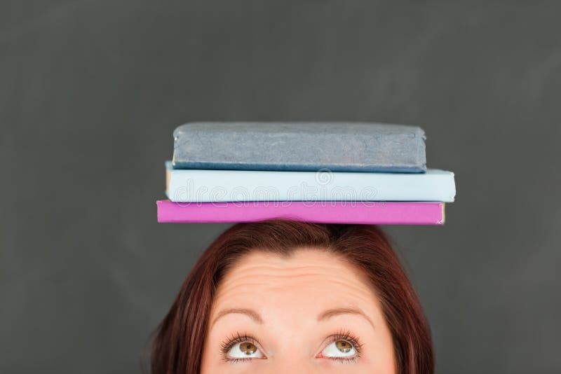 Young Caucasian Wearing Books on Her Head Stock Image - Image of ...