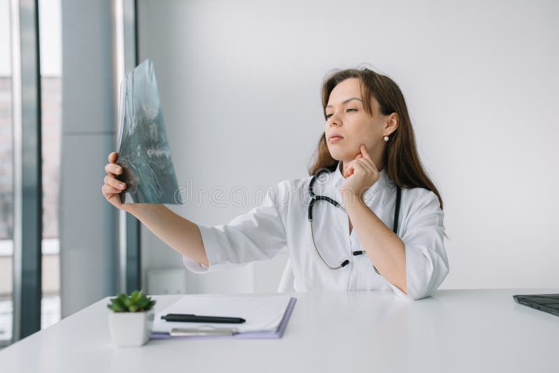 Young Caucasian Woman Doctor Wearing White Medical Coat And Stethoscope