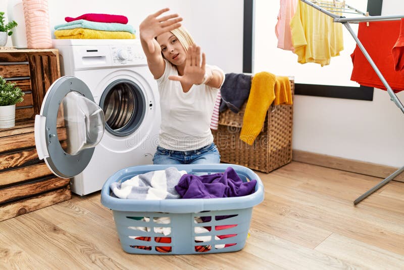Young Caucasian Woman Doing Laundry with Clothes in the Basket Doing ...
