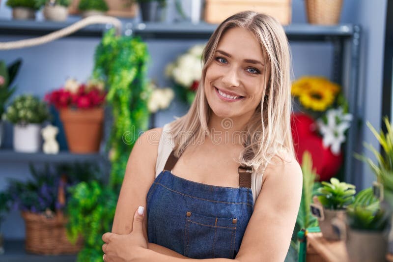 Young Caucasian Woman Florist Smiling Confident Standing with Arms ... Young Caucasian Woman Florist Smiling Confident Standing with Arms ...