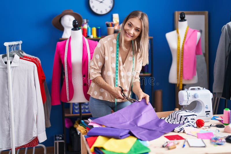 Young Caucasian Woman Tailor Cutting Cloth at Sewing Studio Stock Image ...