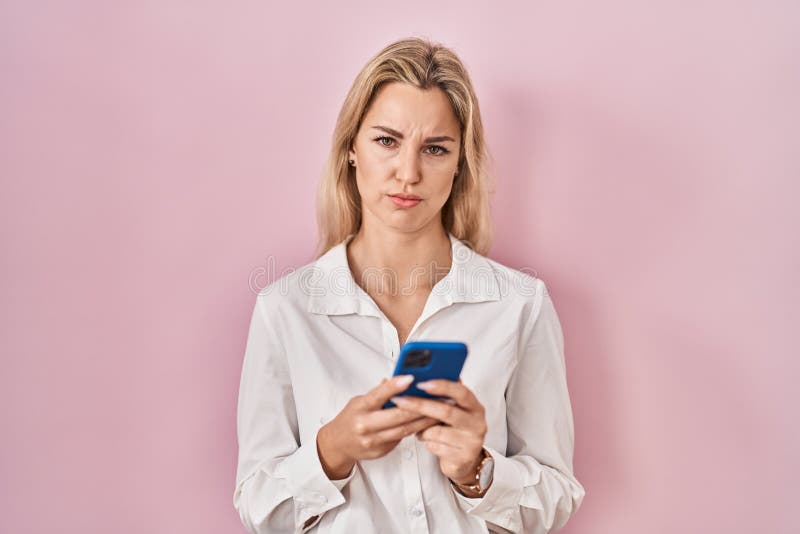 Young Caucasian Woman Using Smartphone Typing Message Depressed and ...