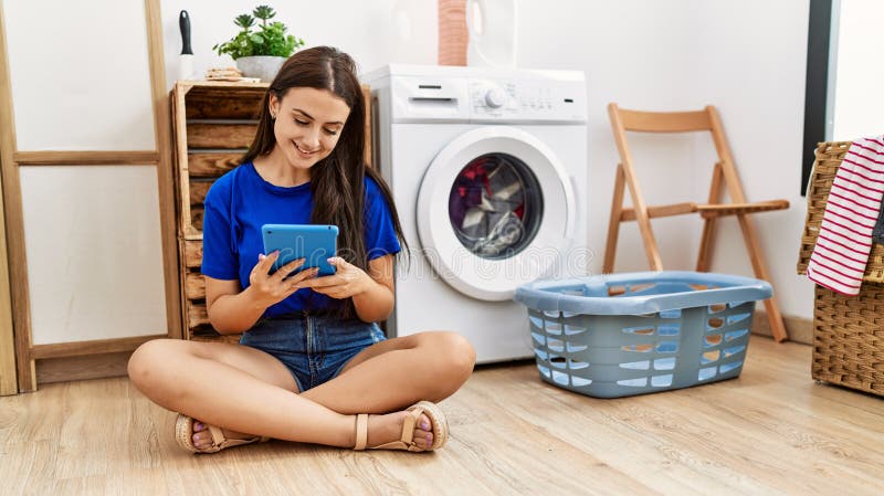Young Caucasian Woman Using Touchpad Waiting for Washing Machine at ...