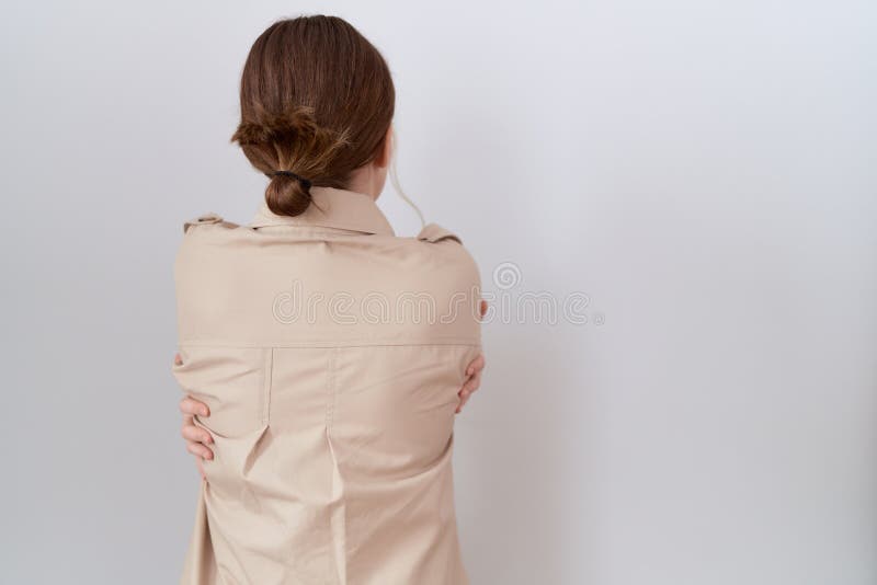 Young Caucasian Woman Wearing Casual Shirt Hugging Oneself Happy And