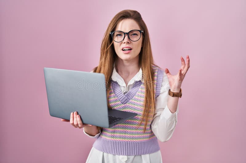 Young Caucasian Woman Working Using Computer Laptop Crazy and Mad ...