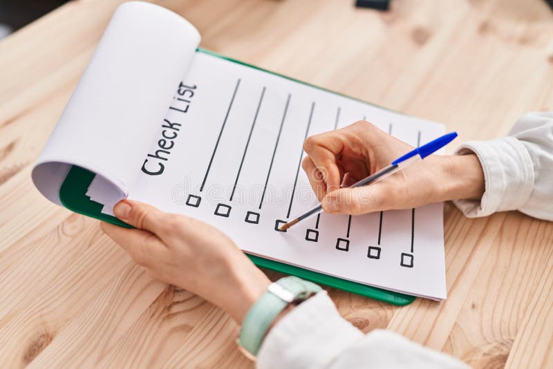 Young Caucasian Woman Writing Mark on Checklist at Office Stock Image ...