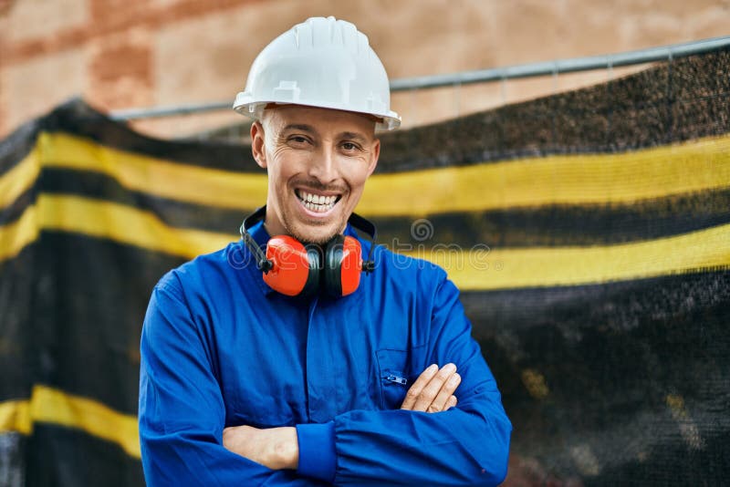 Young Caucasian Worker Smiling Happy Wearing Uniform at the City Stock ...