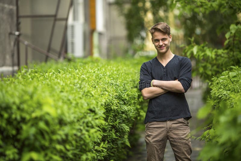Young Charming Guy Standing Outdoors. Happy. Stock Image - Image of ...