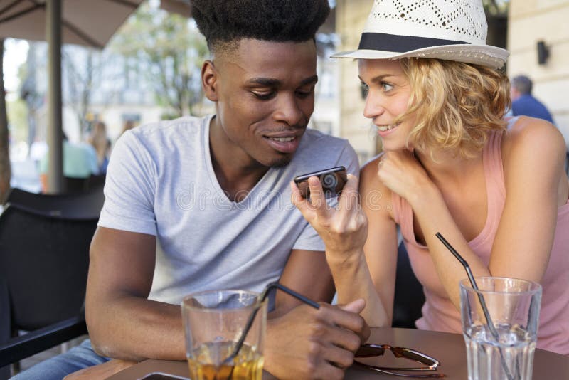 Young Cheerful Couple Making Phone Call in Cafe Bar Stock Photo - Image ...
