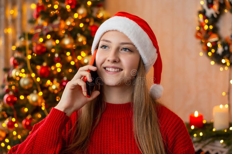 Young Cheerful Girl Talking Over the Phone in Decorated Living Room ... Young Cheerful Girl Talking Over the Phone in Decorated Living Room ...