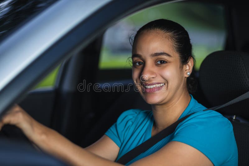 Young Cheerful Hispanic Female Driving Her Car Stock Image - Image of ...