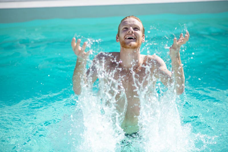 Young Cheerful Man in Pool Water Splashing with Water Stock Image ...