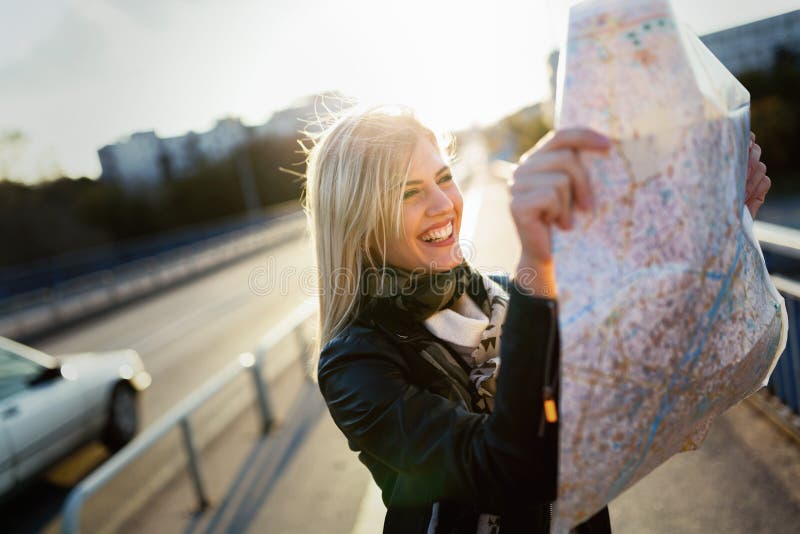 Young Cheerful Woman Looking at Map on Bridge Stock Image - Image of ...