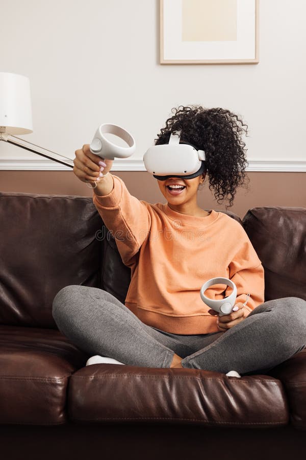 Young Cheerful Woman Relaxing at Home Using Virtual Reality Headset on ...